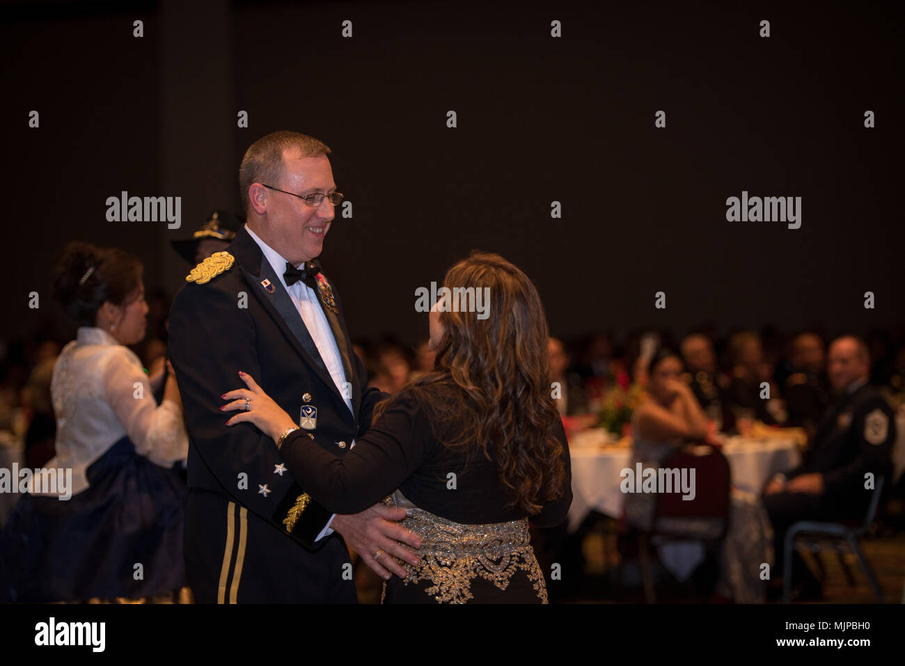 Maj. Gen. Arthur J. Logan dances with his wife as part of a senior ...