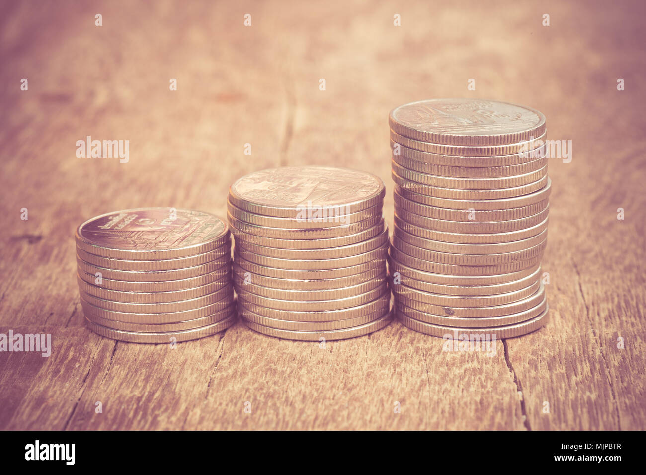 coins on wood with filter effect retro vintage style Stock Photo - Alamy