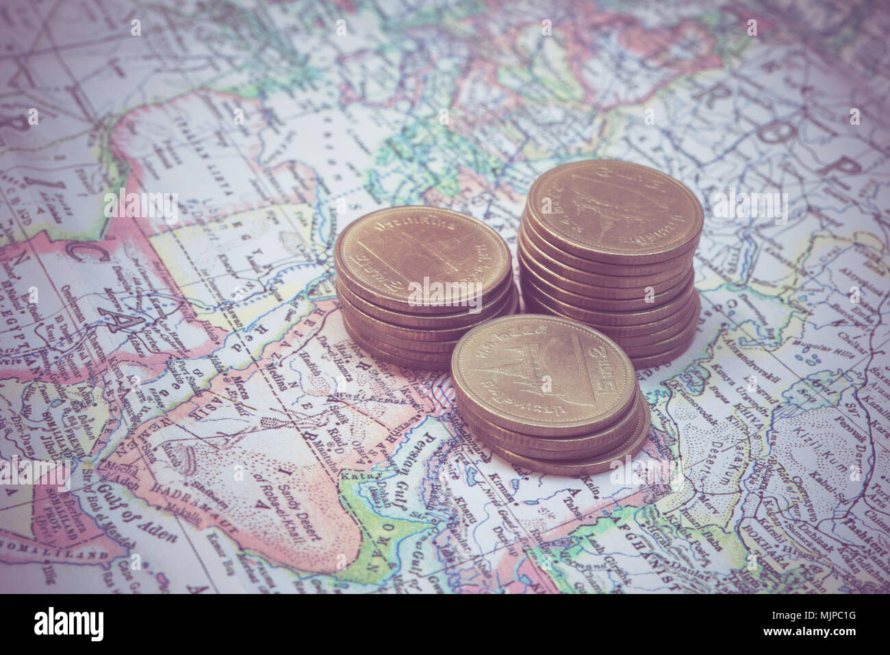 coin and a map with filter effect retro vintage style Stock Photo - Alamy