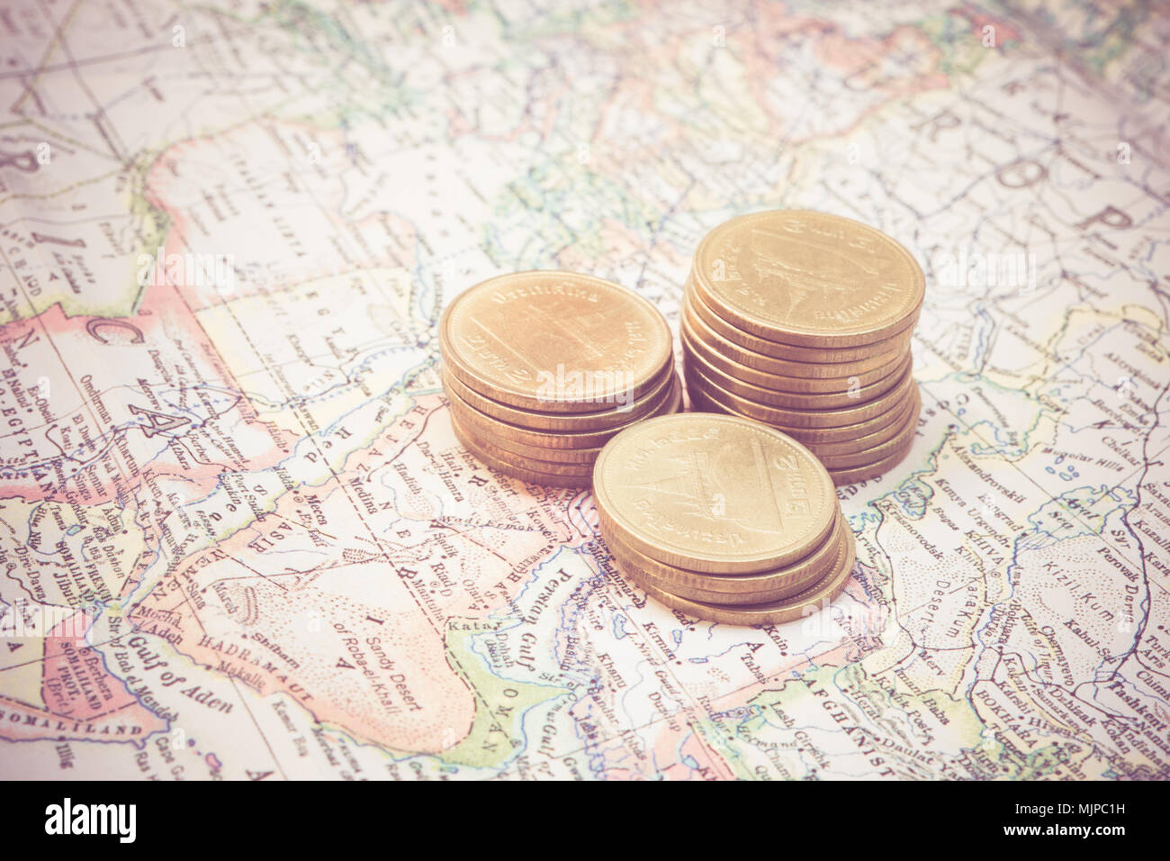 coin and a map with filter effect retro vintage style Stock Photo - Alamy