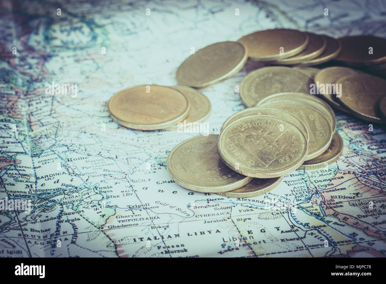 coin and a map with filter effect retro vintage style Stock Photo - Alamy