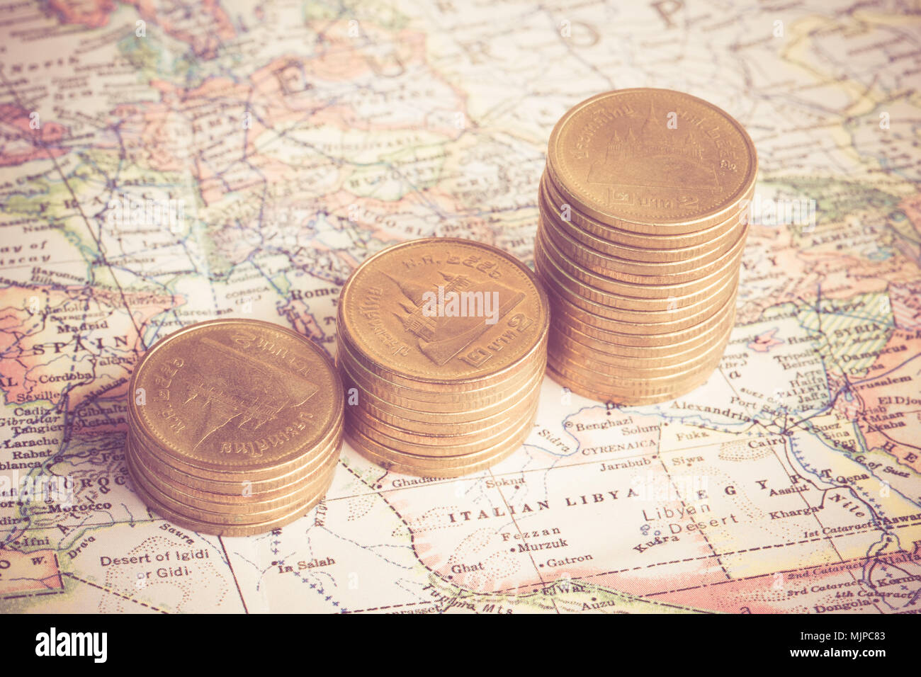 coin and a map with filter effect retro vintage style Stock Photo - Alamy