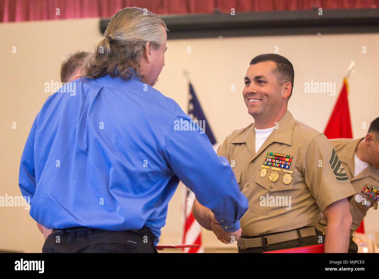 U.S. Marine Corps Gunnery Sgt. Justin L. Santiago a maintenance ...