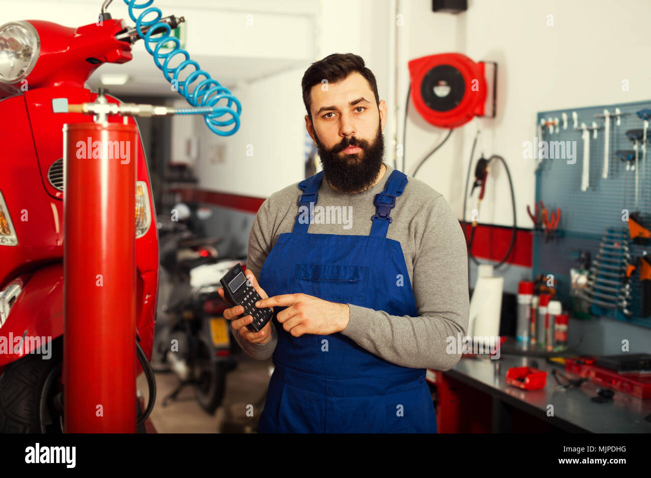 Calculating careful hi-res stock photography and images - Alamy