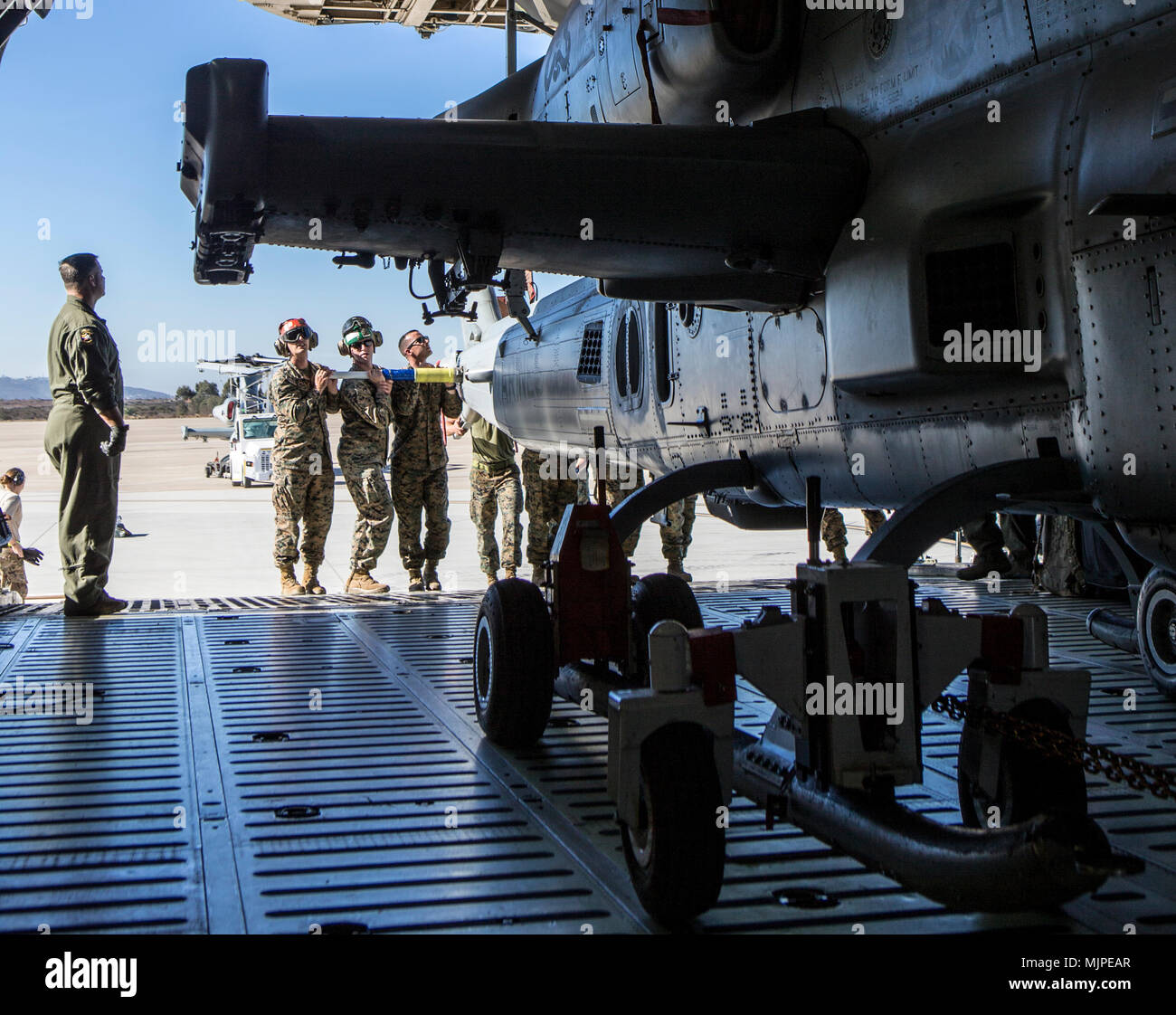 U.S. Marines with Marine Aircraft Group (MAG) 39 guide an AH-1 Z Super ...