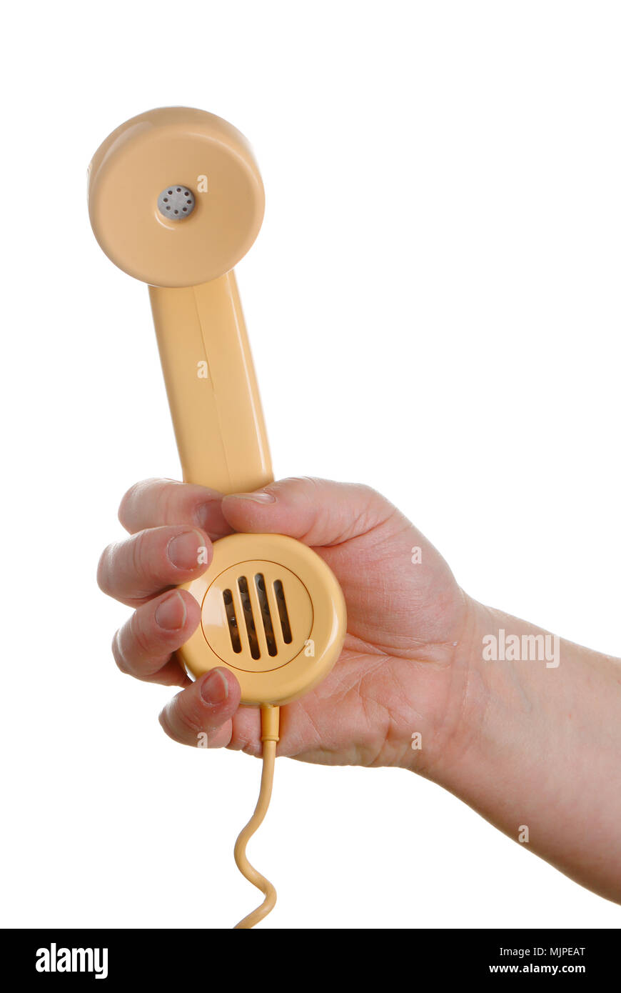 A human hand holding a yellow handset isolated on white background ...