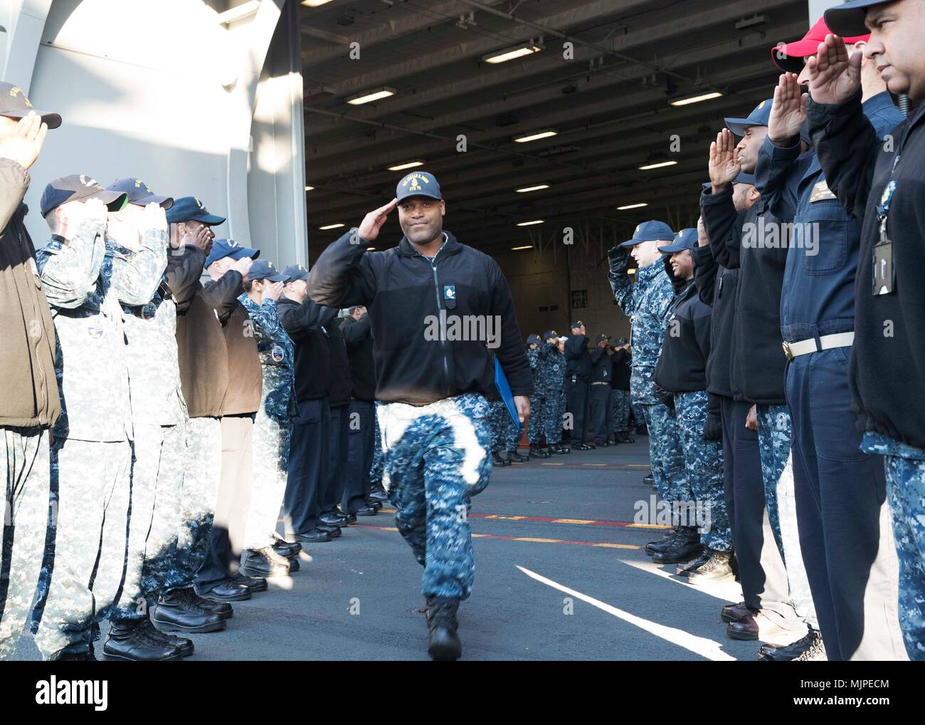 NORFOLK, Va. (Dec. 18, 2017) -- Chief Yeoman Berwyn Tinnion gets piped ...