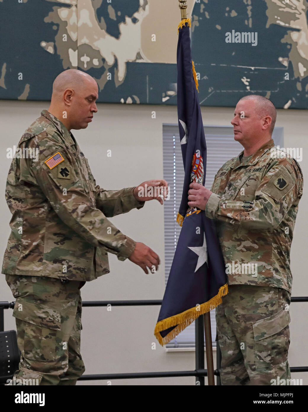Incoming Adjutant General Maj. Gen. Michael C. Thompson passes the TAG ...