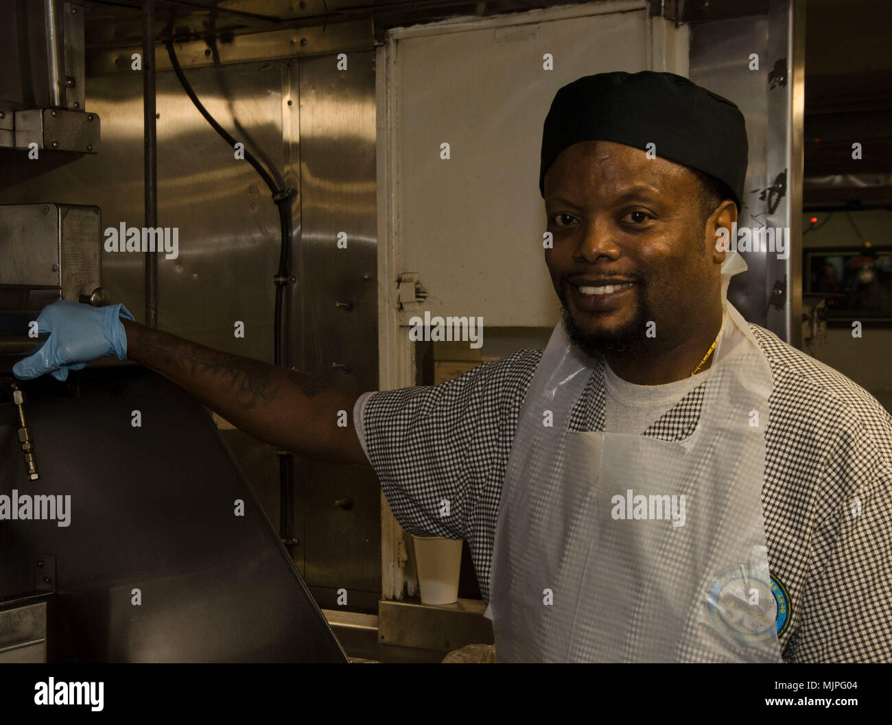 PORTLAND, Ore. (Dec. 13, 2017) - Andrew Leggett, 2nd Cook aboard the ...