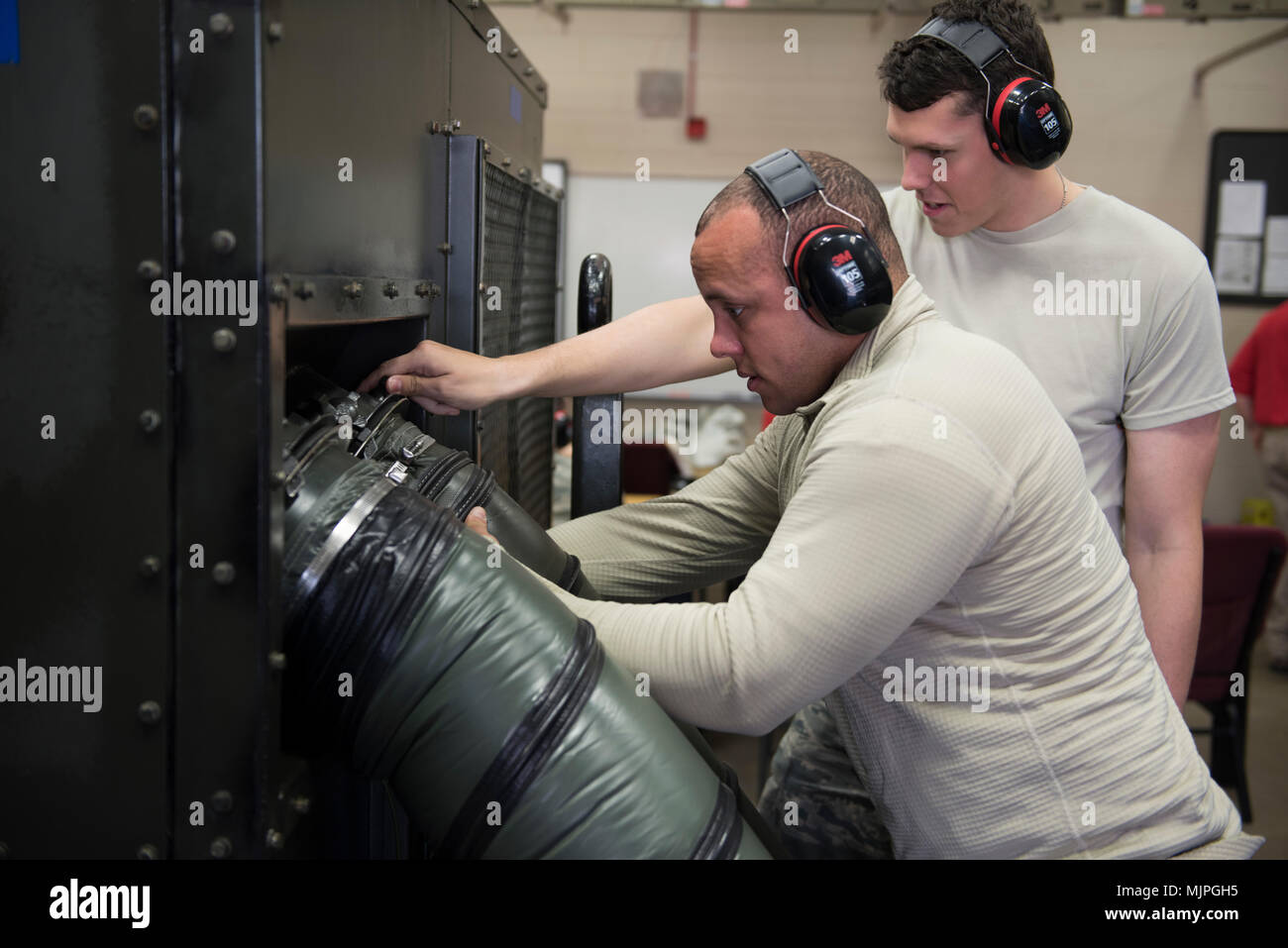 Staff Sgt. Jared Silva, left, and Airman Daniel Graham, 361st Training ...