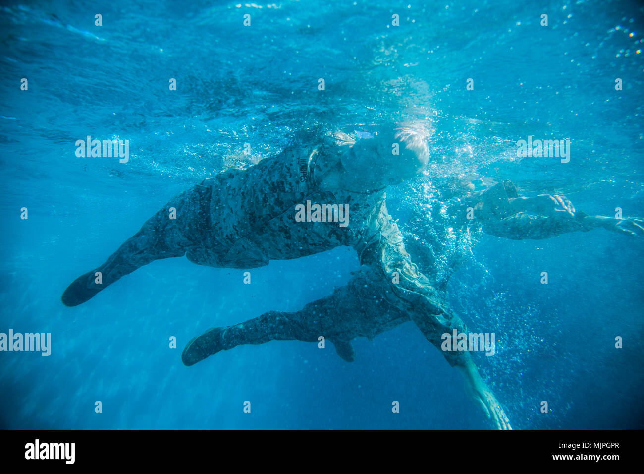 U.S. Marines with 7th Engineer Support Battalion conduct the 250 meter ...
