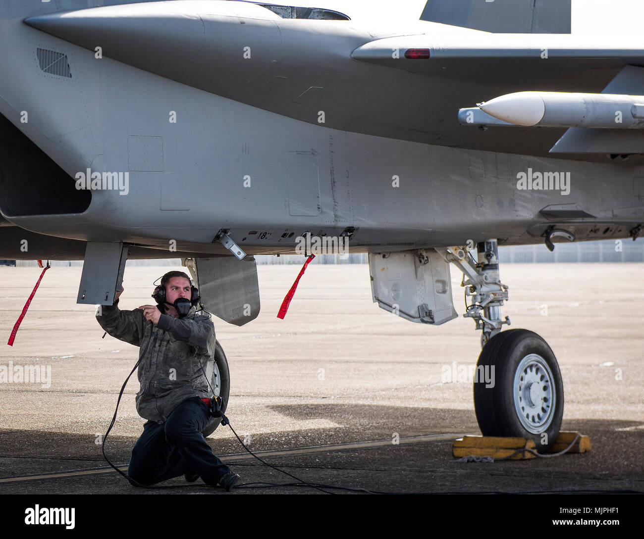 An Airman performs checks after completing hot pit refueling Dec. 14 at ...