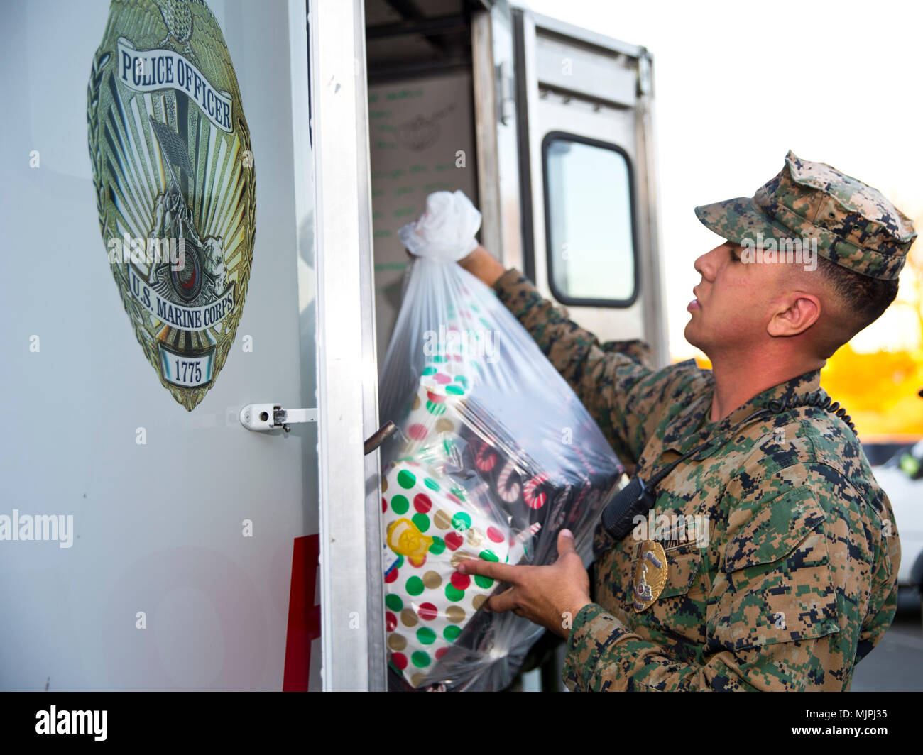 Marines and police officers with the Provost Marshal’s Office, deliver ...