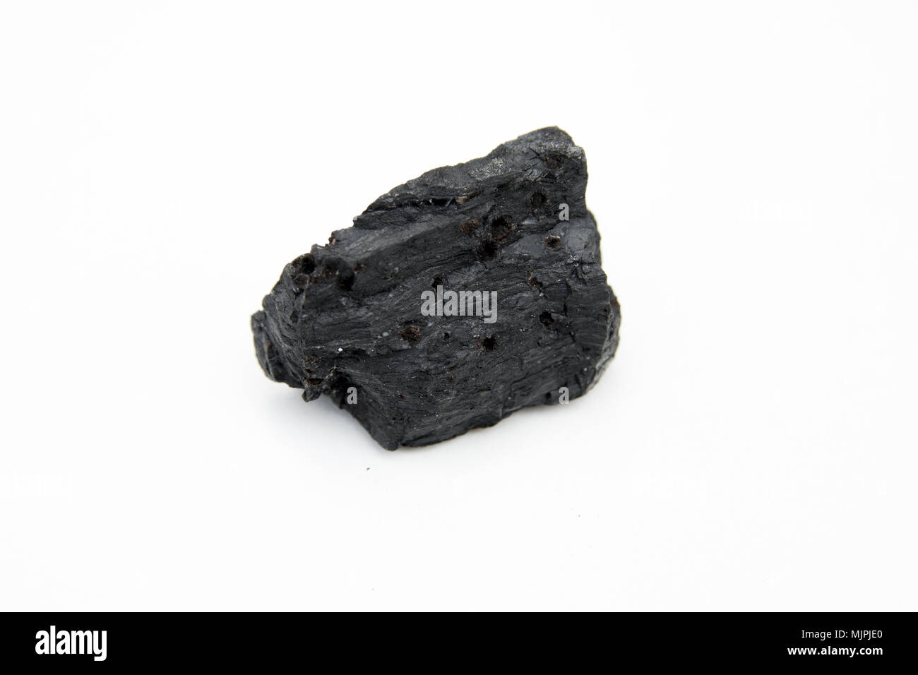 extreme close up with a lot of details of coal mineral isolated over ...