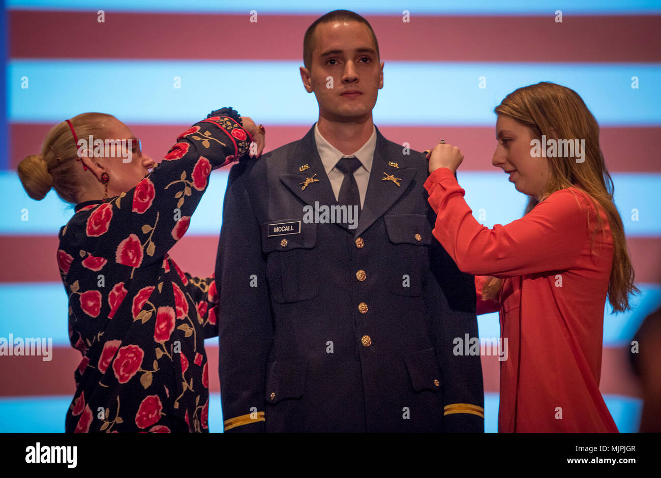 U.S. Army 2nd Lt. Benjamin McCall’s mother and sister pin on his rank ...