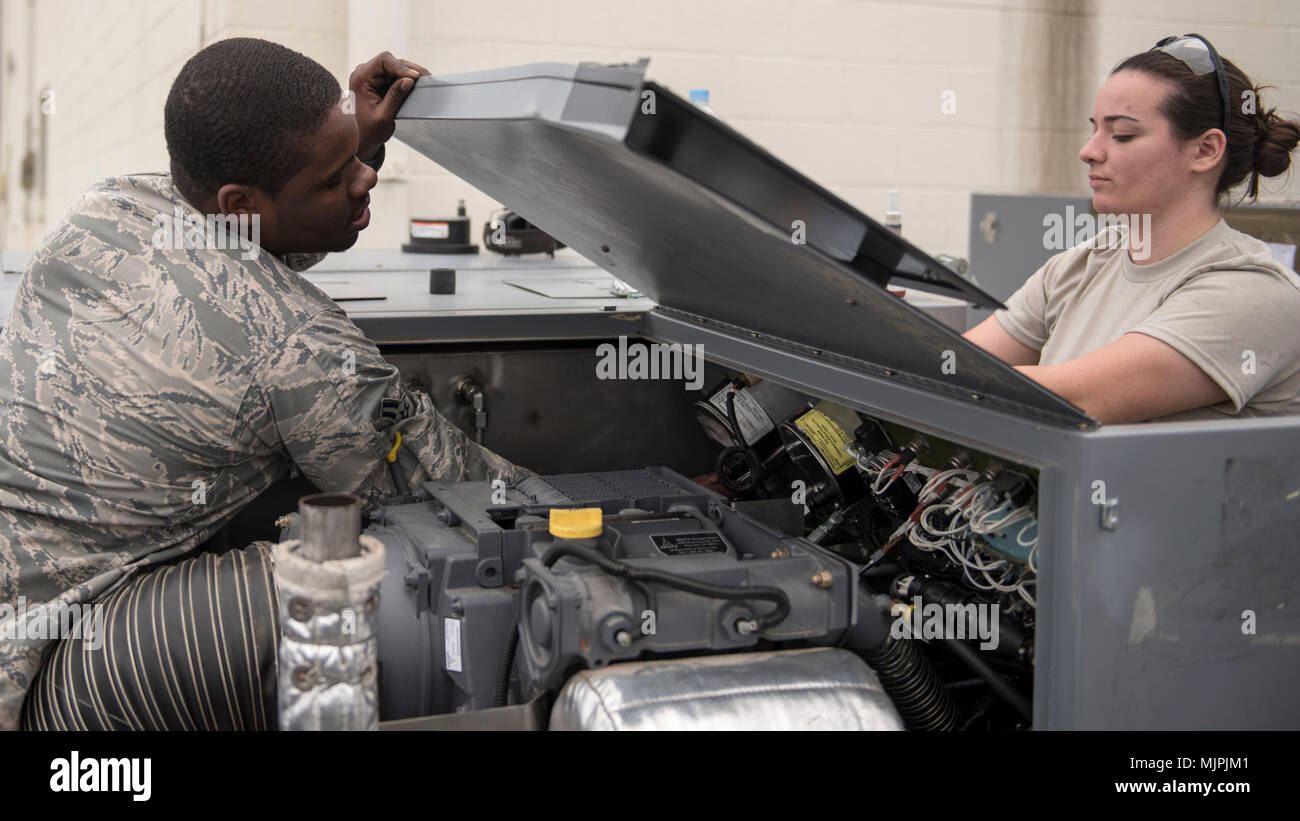 U.S. Air Force Airman 1st Class Carl Knowles (left), and Airman 1st ...