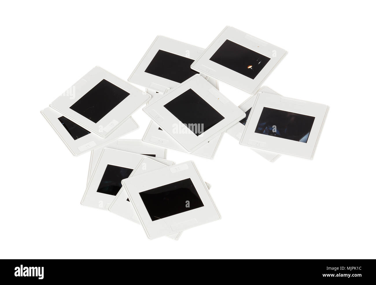 A group of white plastic framed slides isolated on white background ...