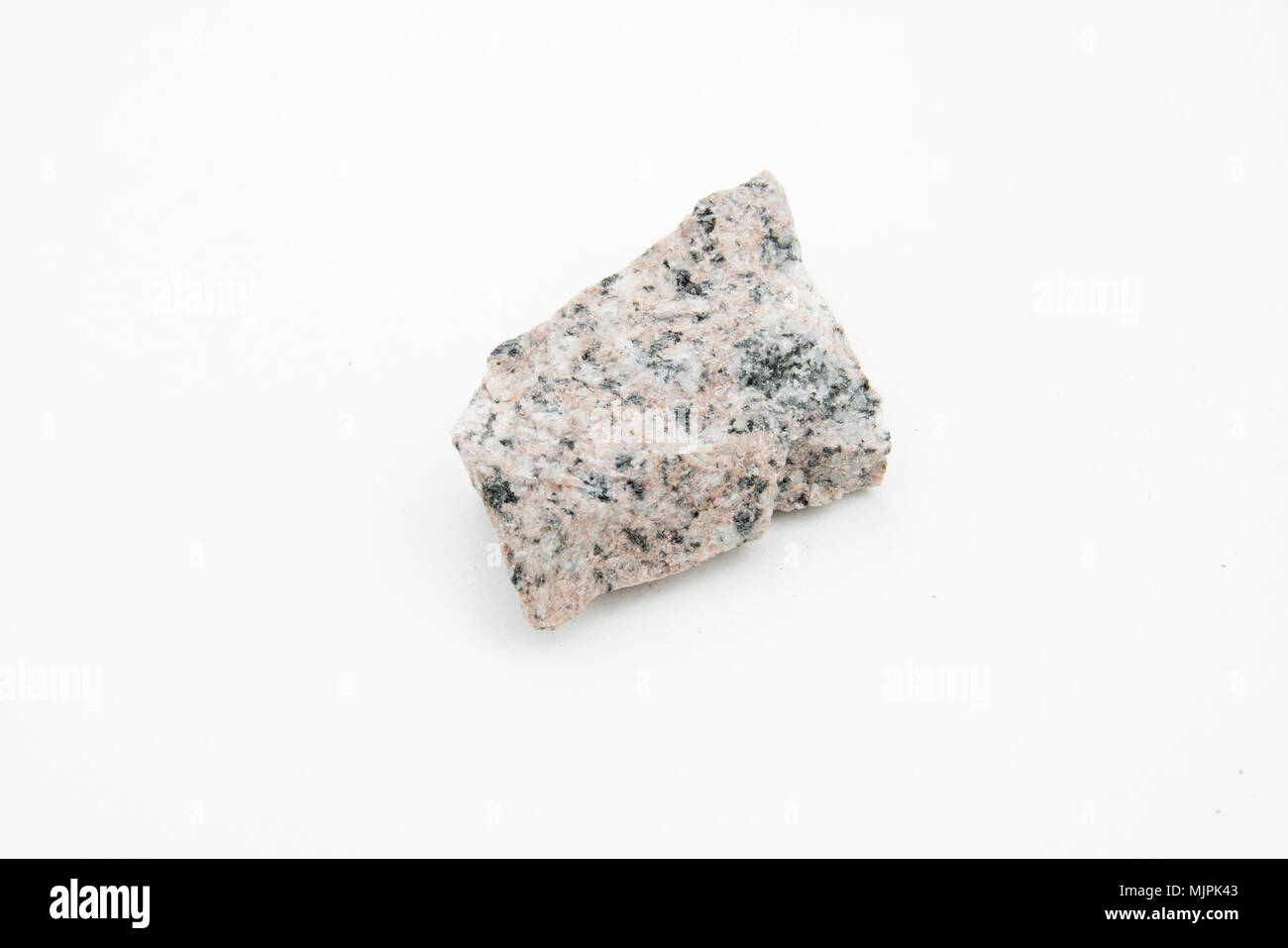 extreme close up with a lot of details of syenite rock isolated over white background Stock ...