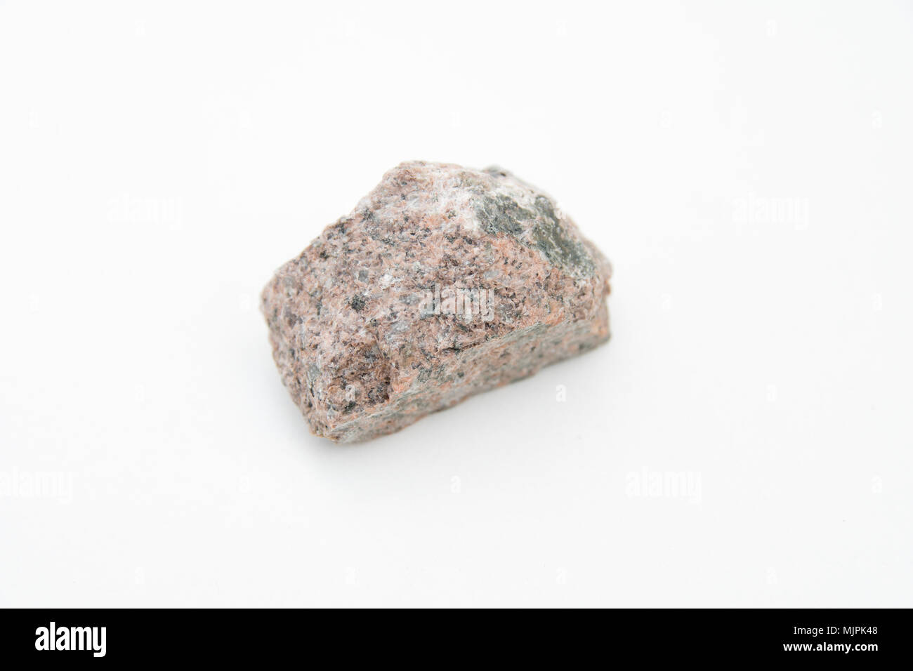 extreme close up with a lot of details of quartz syenite isolated over white background Stock ...