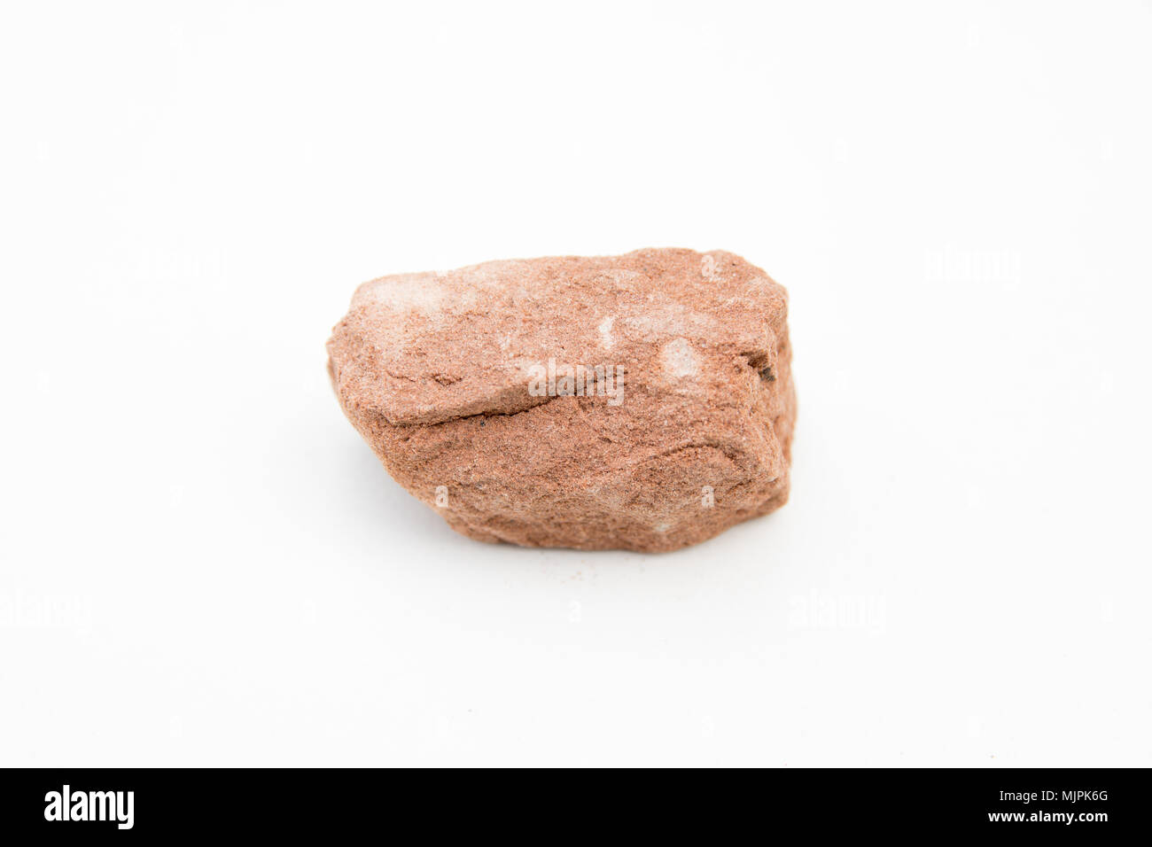 extreme close up with a lot of details of siltstone isolated over white ...