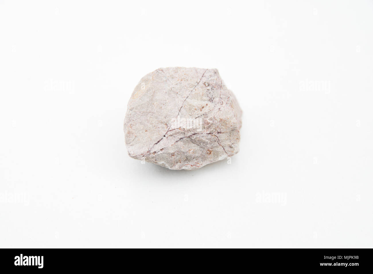 extreme close up with a lot of details of marl rock isolated over white ...