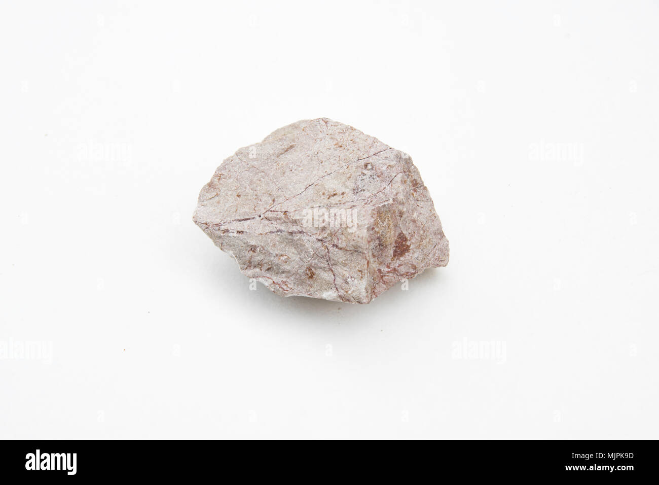 extreme close up with a lot of details of marl rock isolated over white ...