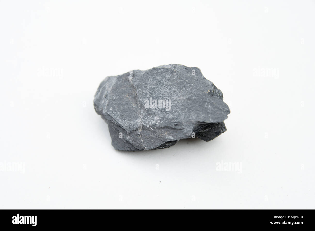 extreme close up with a lot of details of slate rock isolated over ...