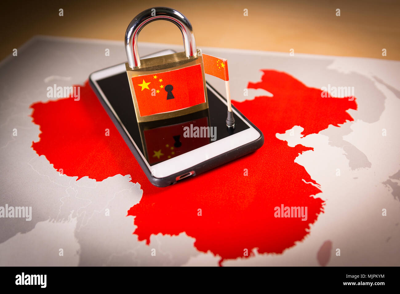 Padlock, China flag on a smartphone and China map, symbolizing the ...