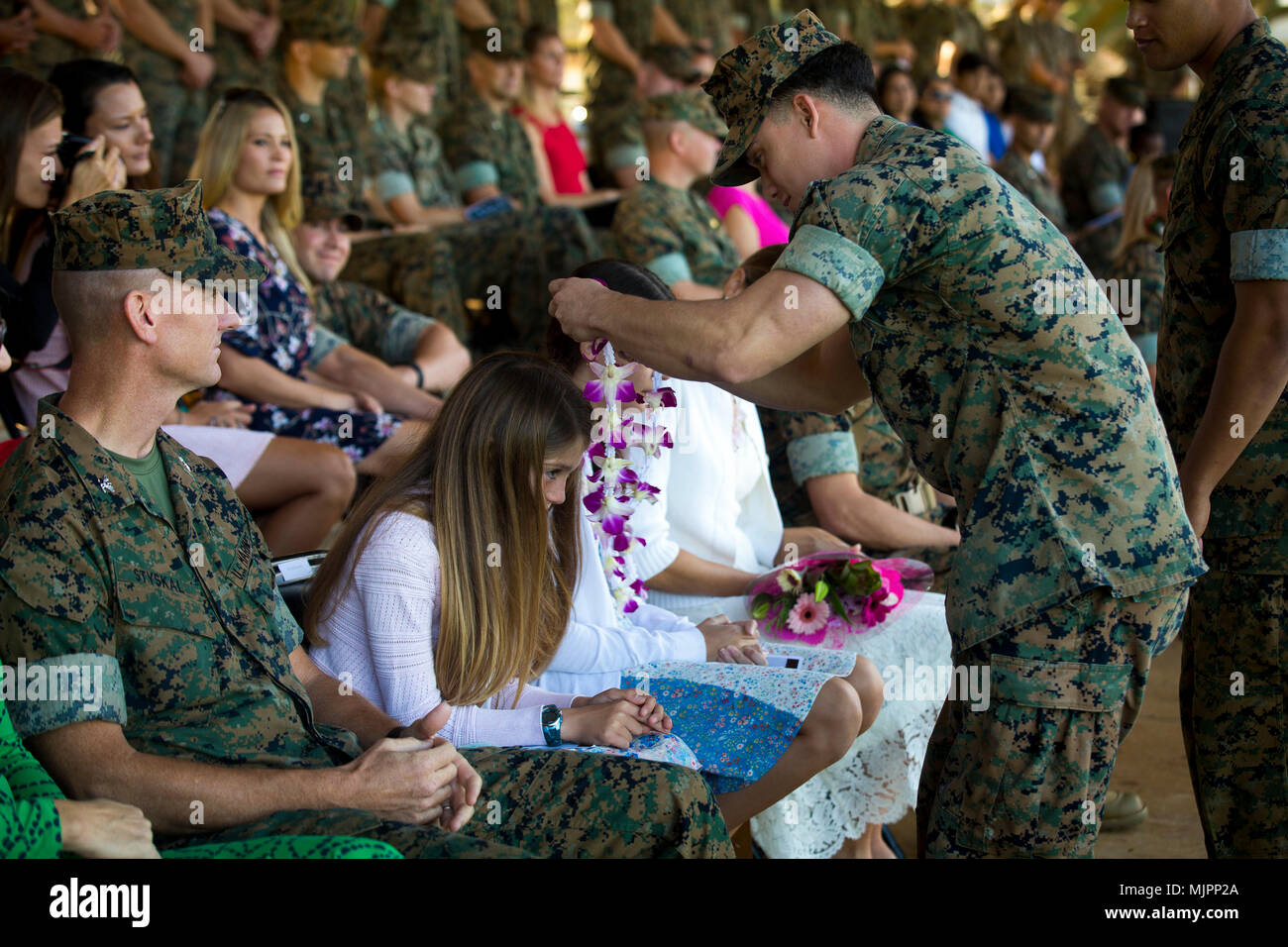 Marines with 1st Battalion, 3rd Marine Regiment deliver flowers and lei ...