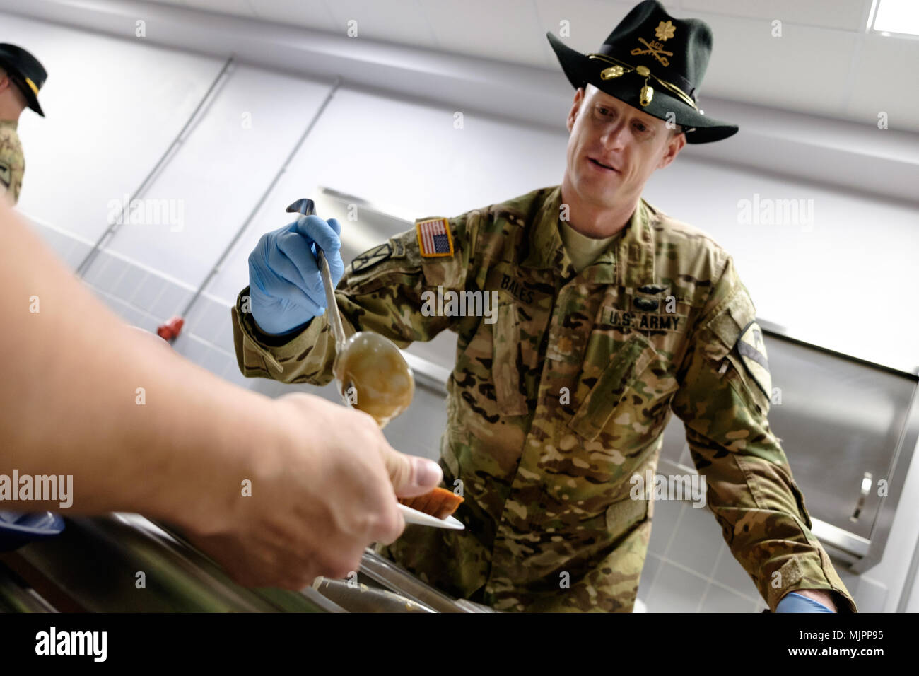 LIELVARDE AIR BASE, LATVIA (Dec. 22, 2017): Major Mike Bales ladles out ...