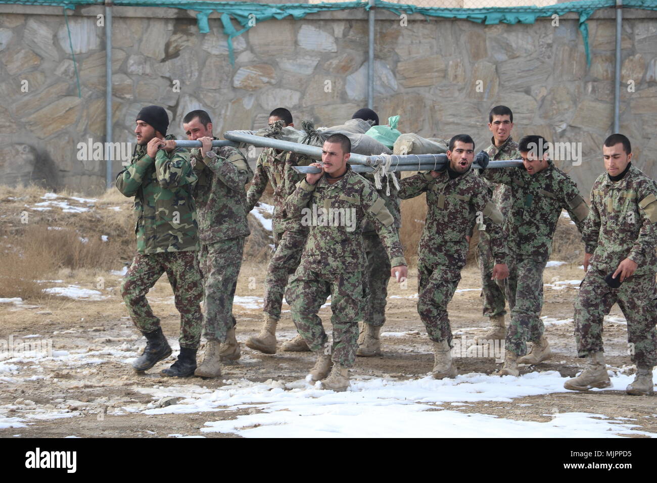 Afghan soldiers carry a weighted litter during the 22nd Commando ...