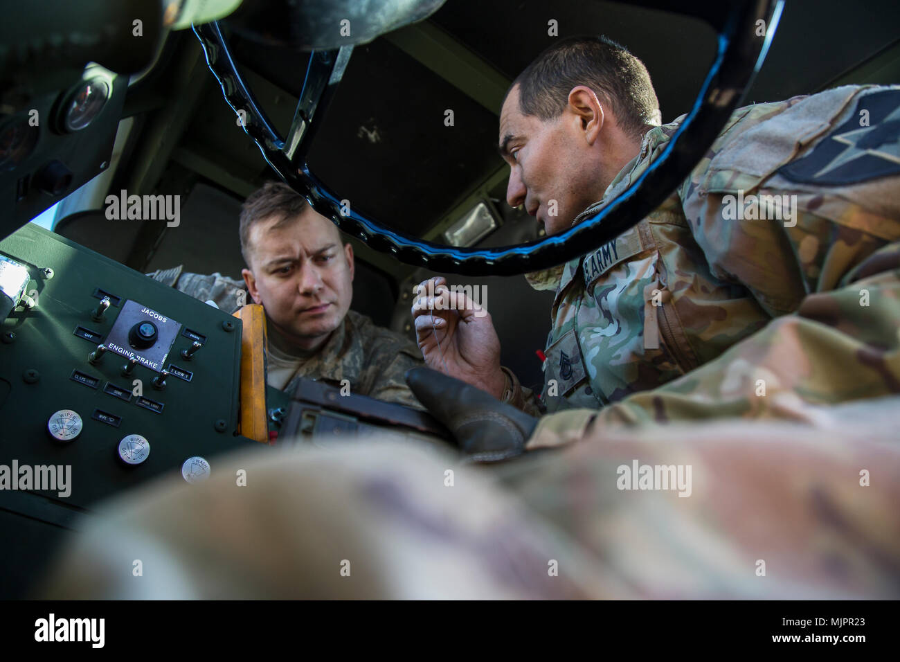 U.S. Army Sgt. Stephen Mathews (Left) and Sgt. 1st Class Denis Valora ...