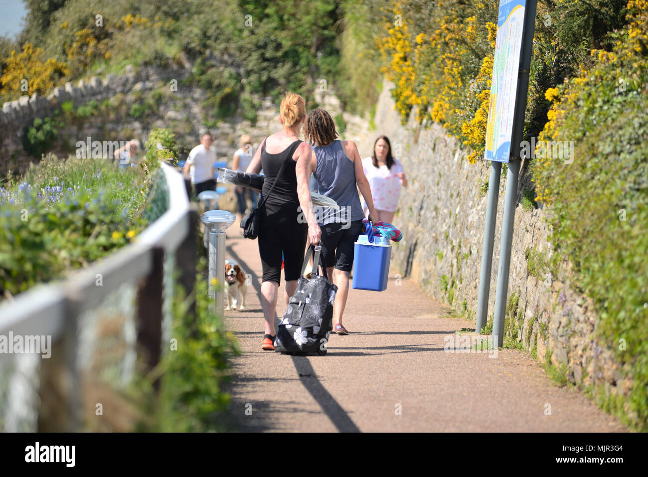 Boscombe, Bournemouth, Dorset. People heading to the beach in May ...