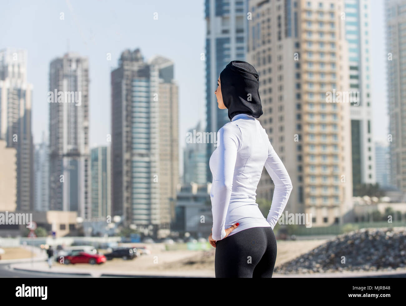 Arabic woman running outdoor and wearing hijab Stock Photo - Alamy
