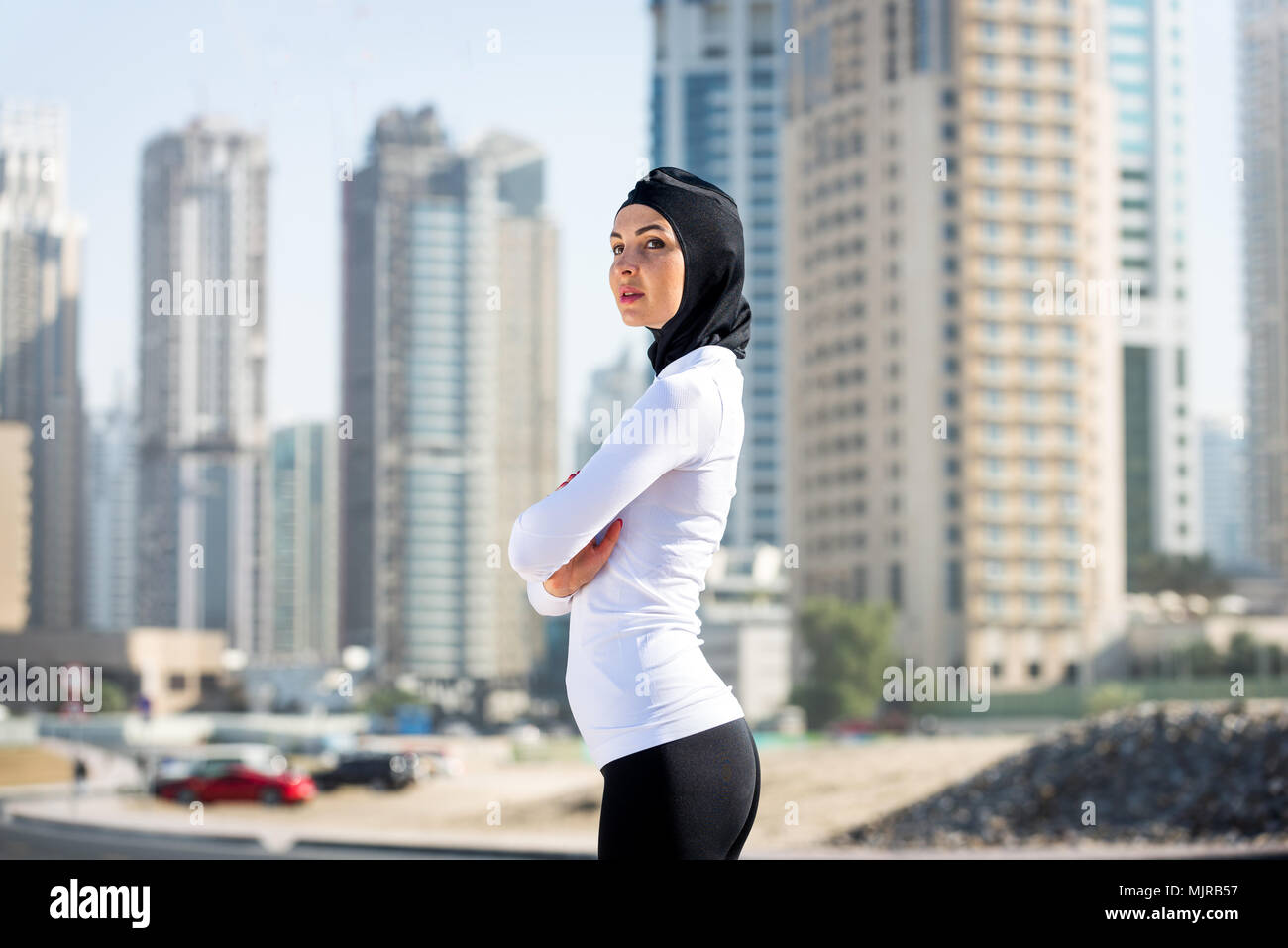 Arabic woman running outdoor and wearing hijab Stock Photo - Alamy