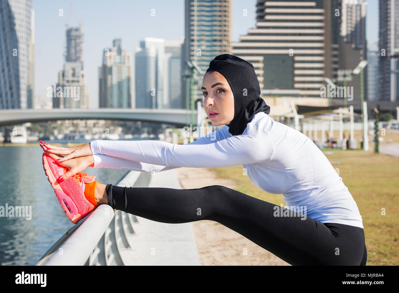 Arabic woman running outdoor and wearing hijab Stock Photo - Alamy
