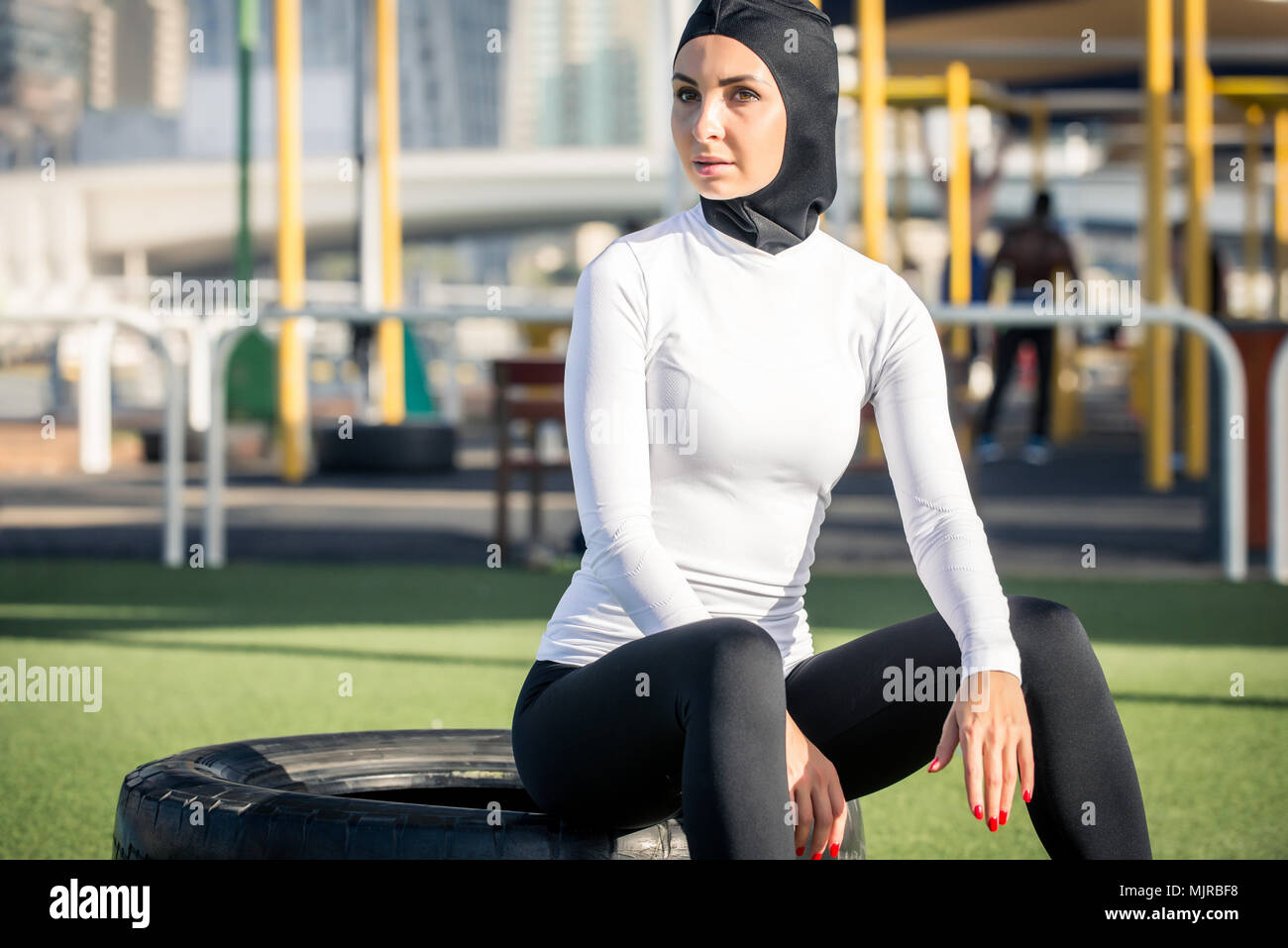 Arabic woman running outdoor and wearing hijab Stock Photo - Alamy
