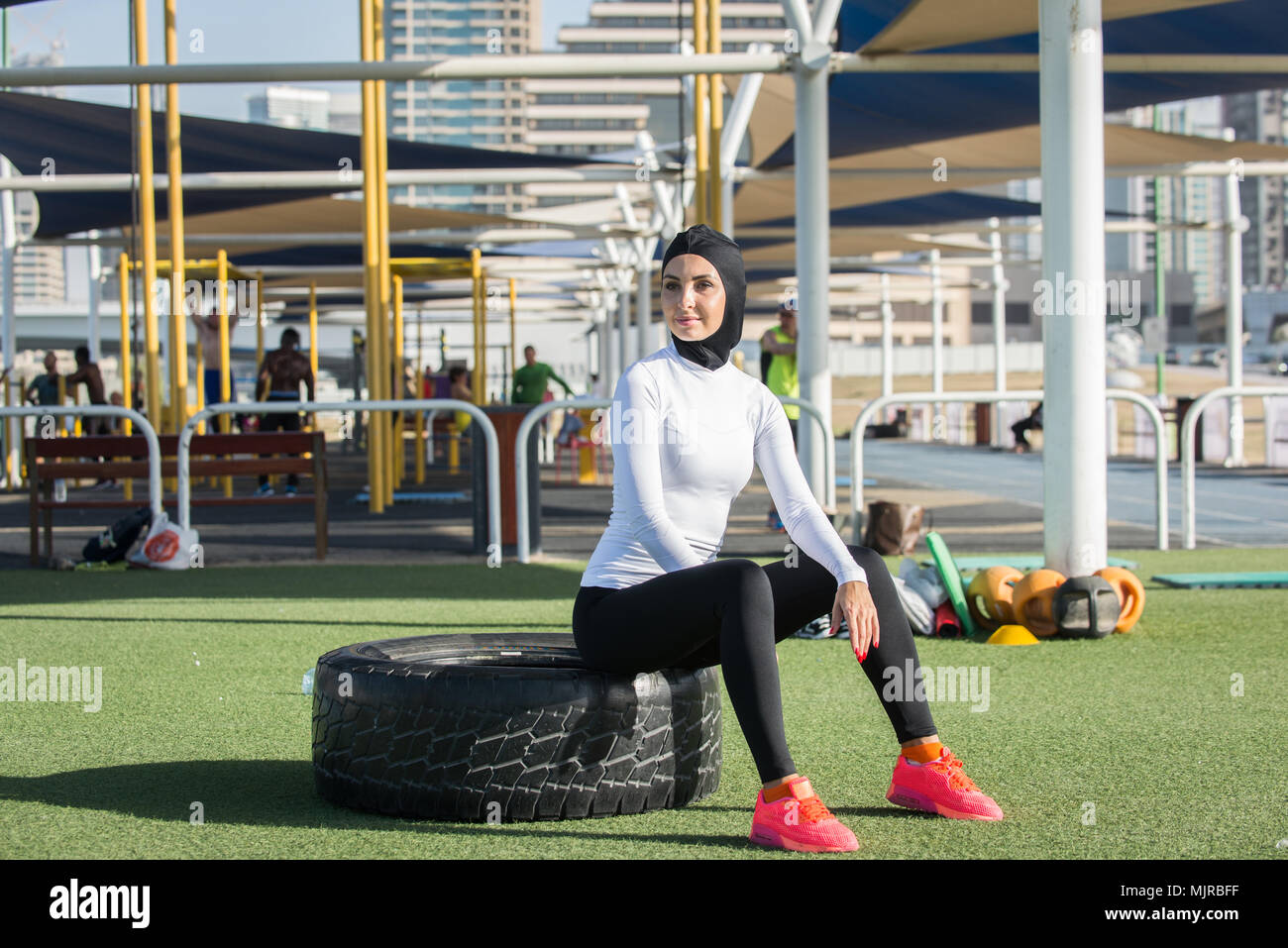 Arabic woman running outdoor and wearing hijab Stock Photo - Alamy