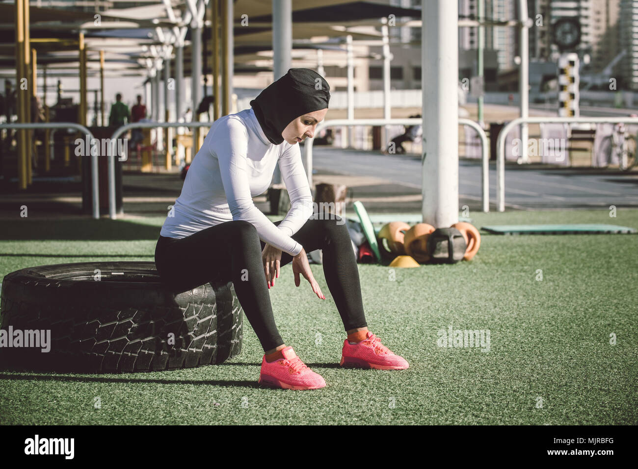 Arabic woman running outdoor and wearing hijab Stock Photo - Alamy