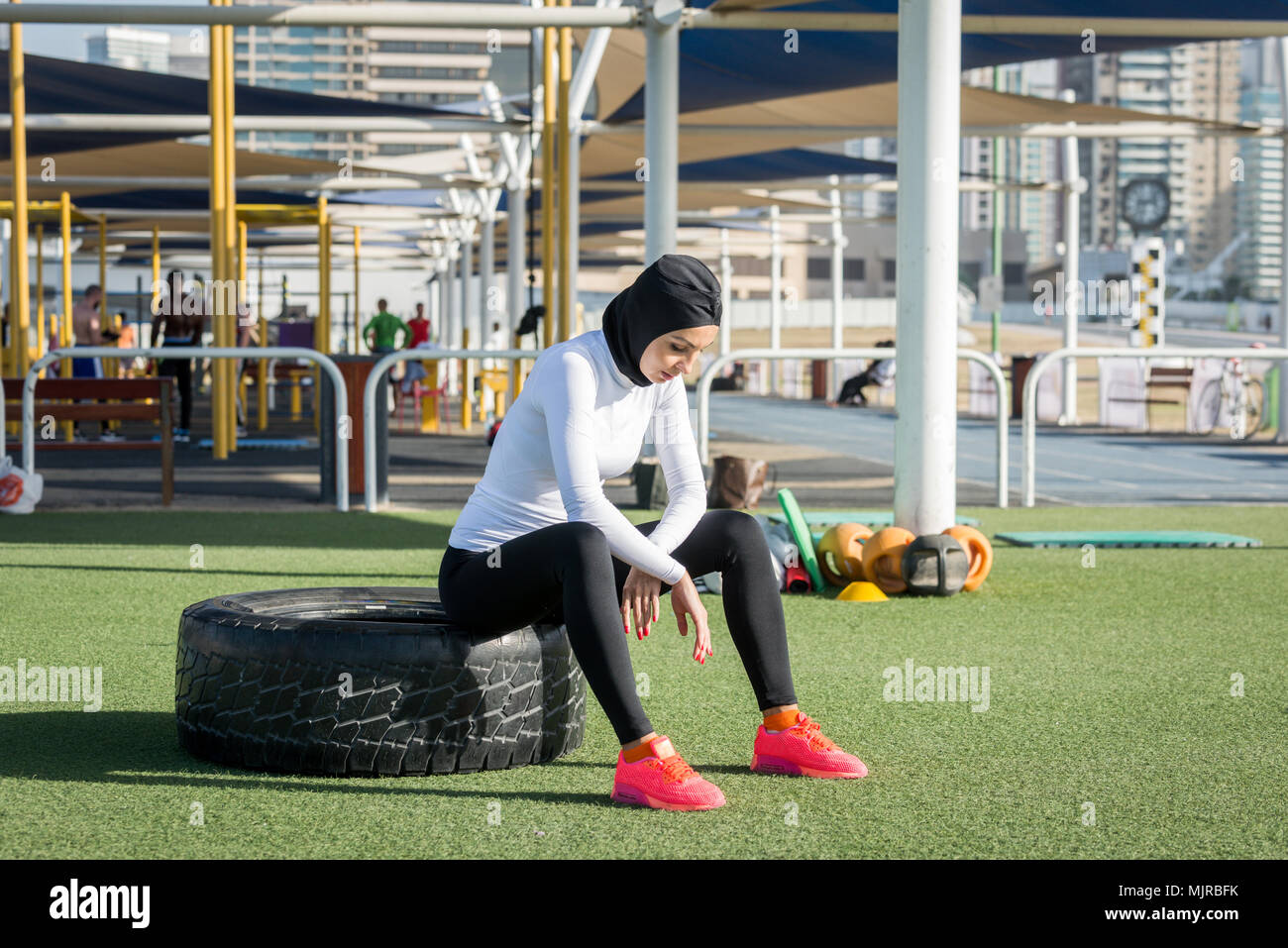 Arabic woman running outdoor and wearing hijab Stock Photo - Alamy