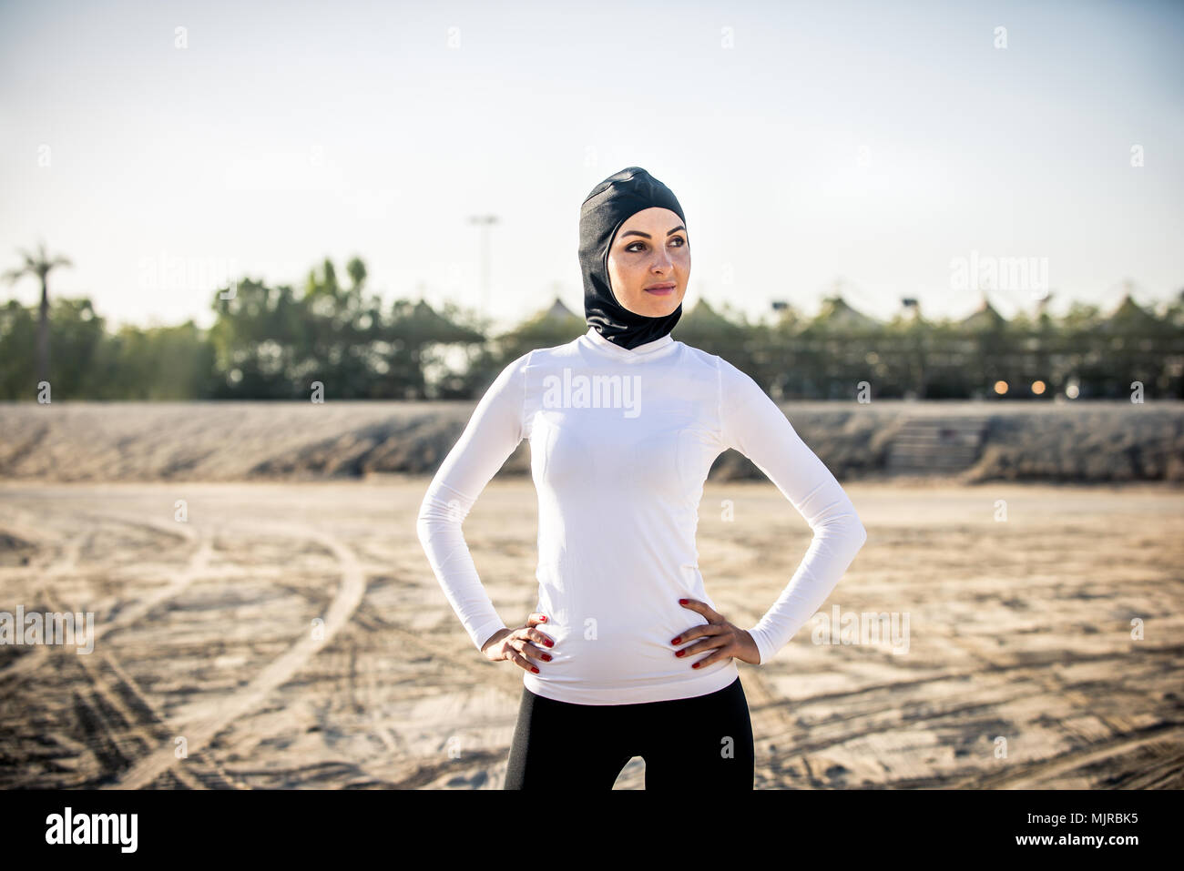 Arabic woman running outdoor and wearing hijab Stock Photo - Alamy