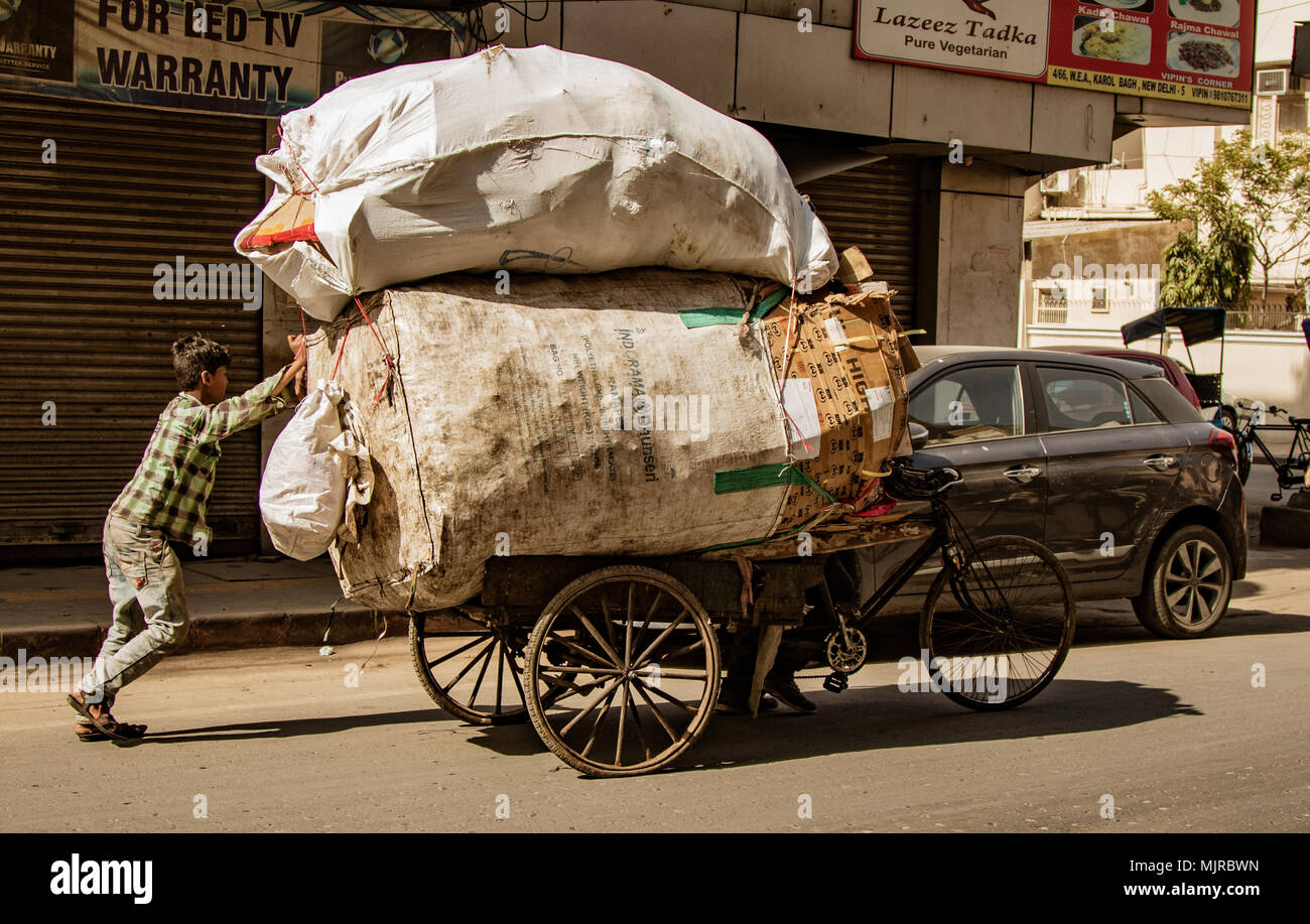 New Dehli, India, Feb 19, 2018: Man carrying massive load on bicycle in ...