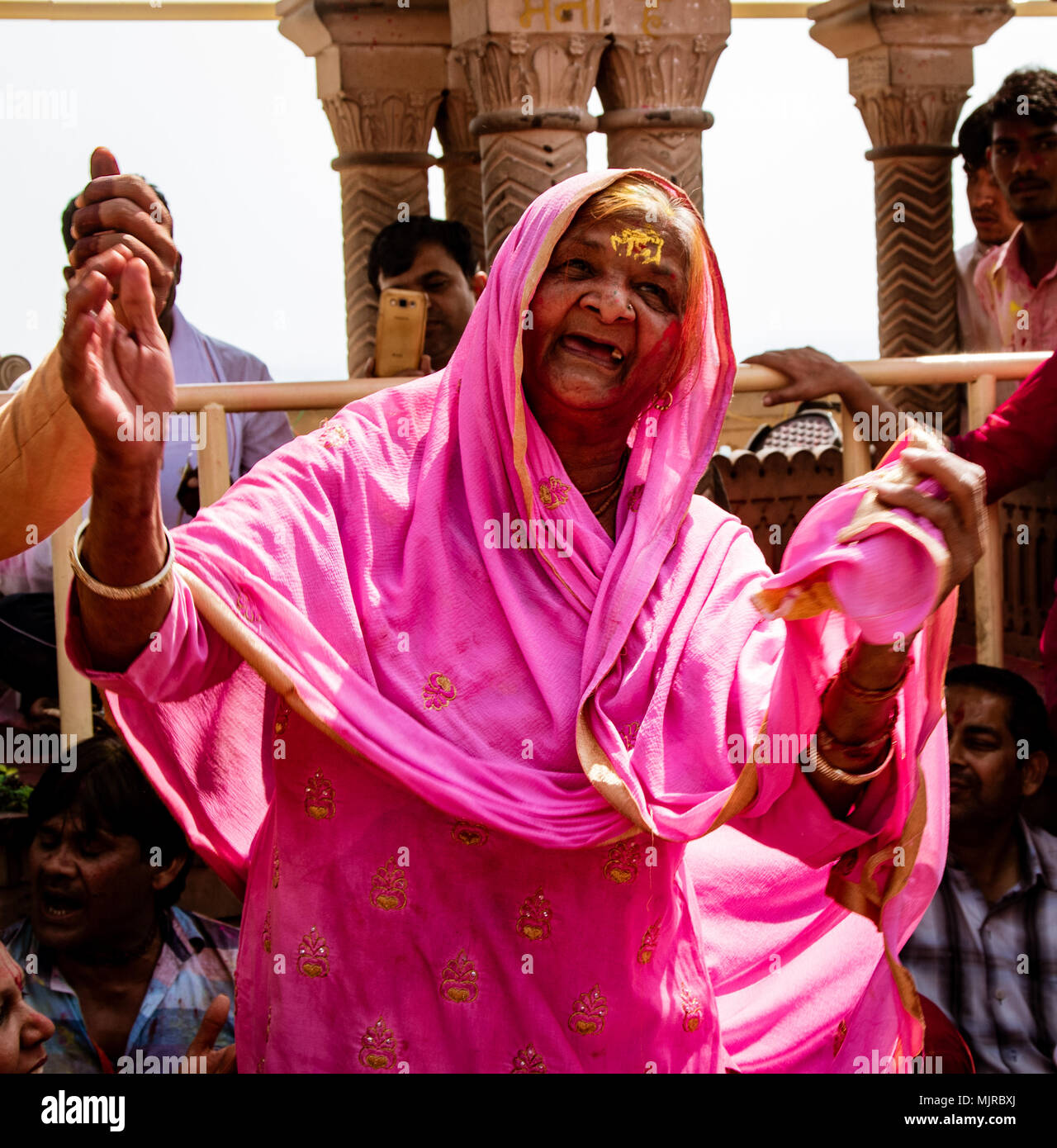Barsana, India, Holi Festival, Feb 23, 2018 - Old woman with only one ...