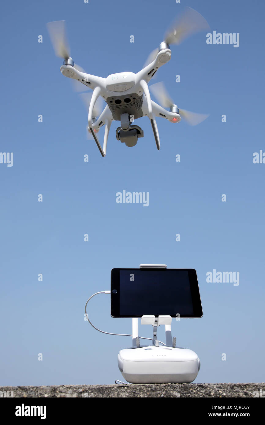 drone and remote controller, clear blue sky background Stock Photo - Alamy