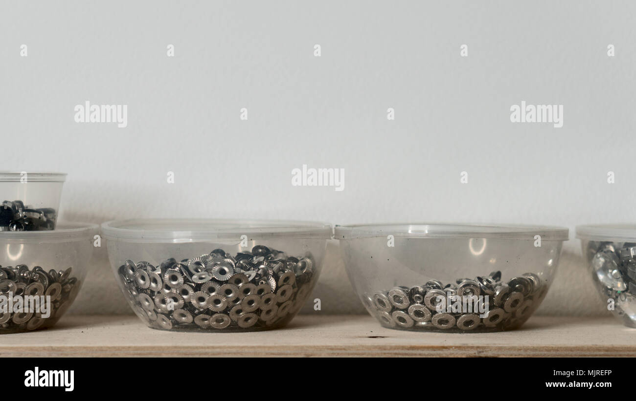 Rivet fasteners in plastic containers. Tanner's workshop Stock Photo ...