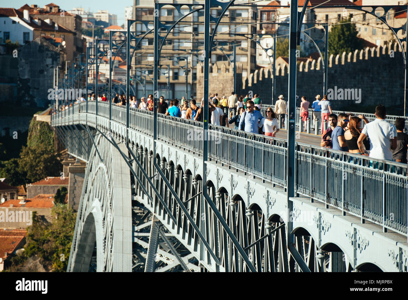 Tourists walking on the Dom Luís I bridge in Porto, Portugal Stock ...