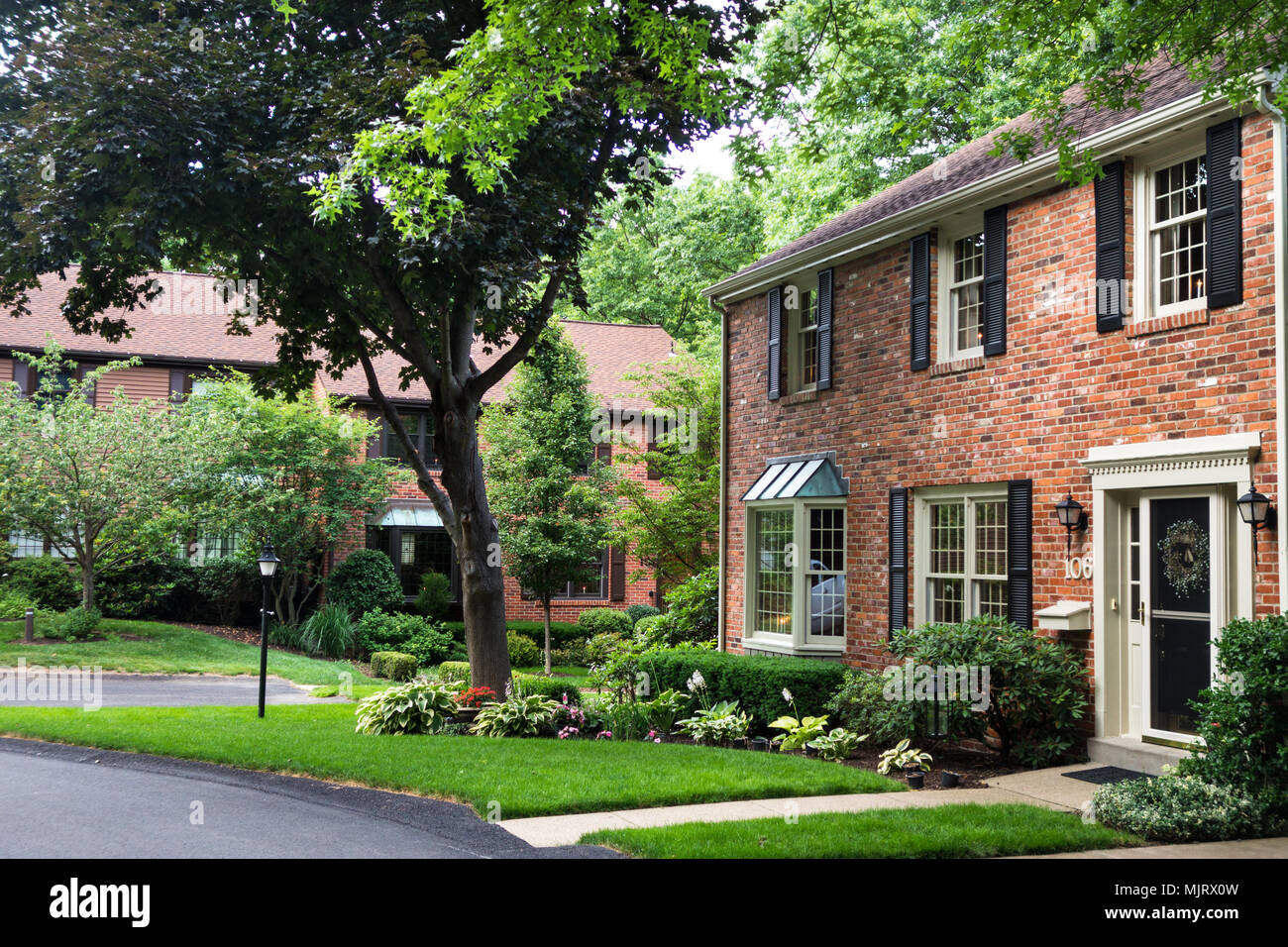 Quaint townhomes in a neatly manicured suburban neighborhood in western ...