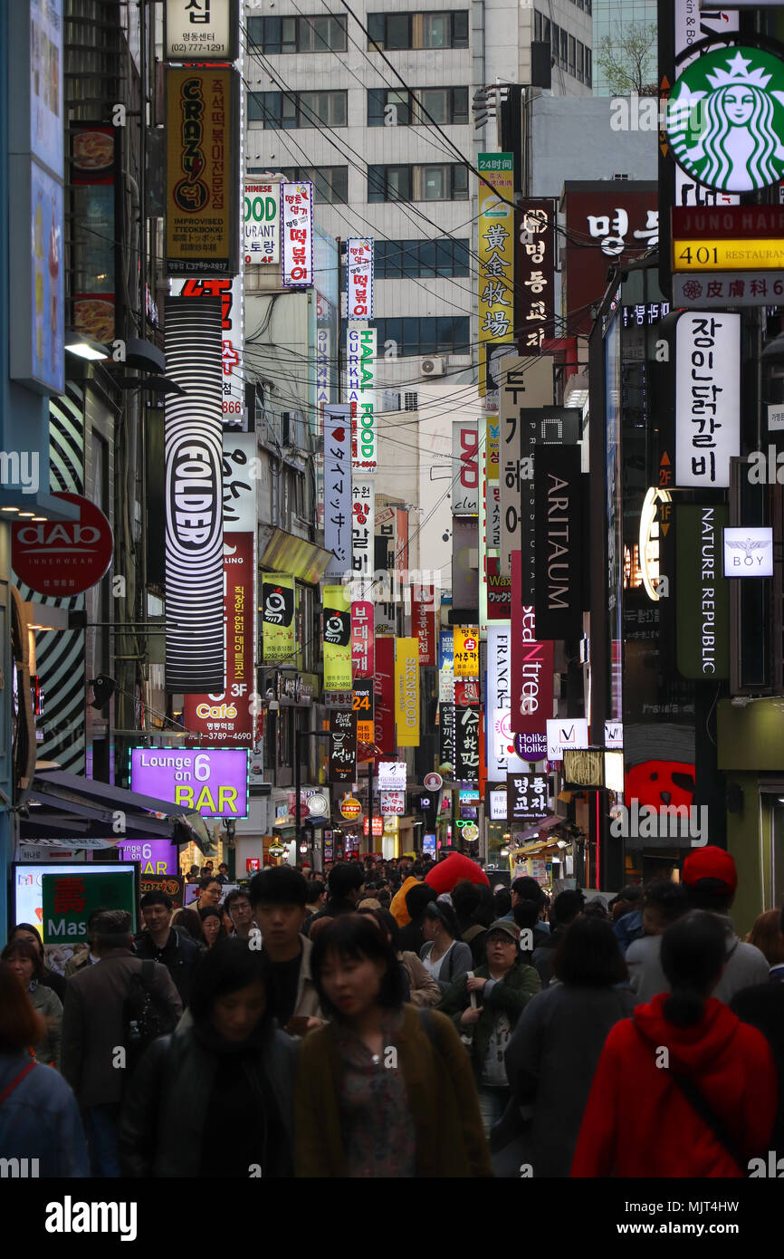 People flock to the bustling Myeongdong area of Seoul, South Korea, in ...
