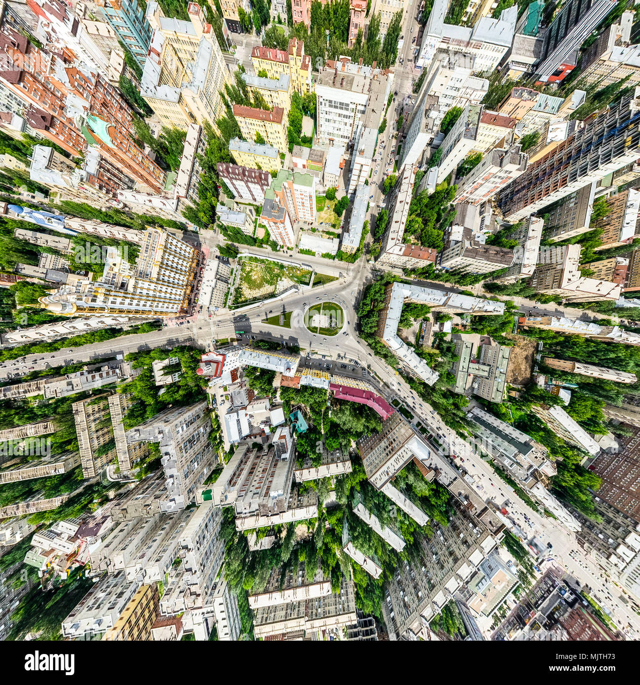 Aerial city view with crossroads and roads, houses, buildings, parks ...