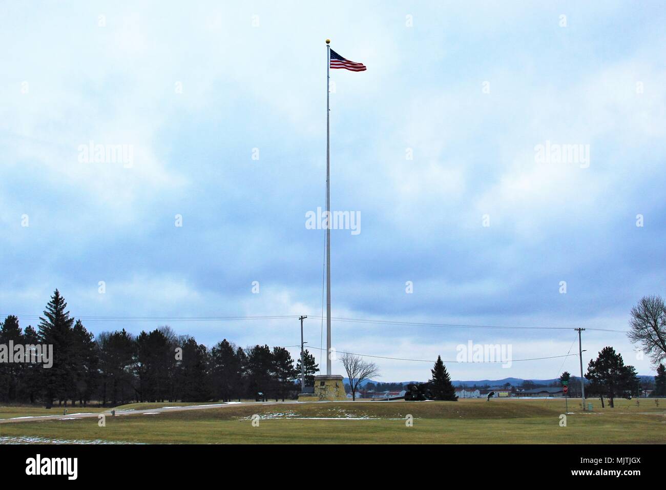 The flag of the United States of America is brightened by a backdrop of ...